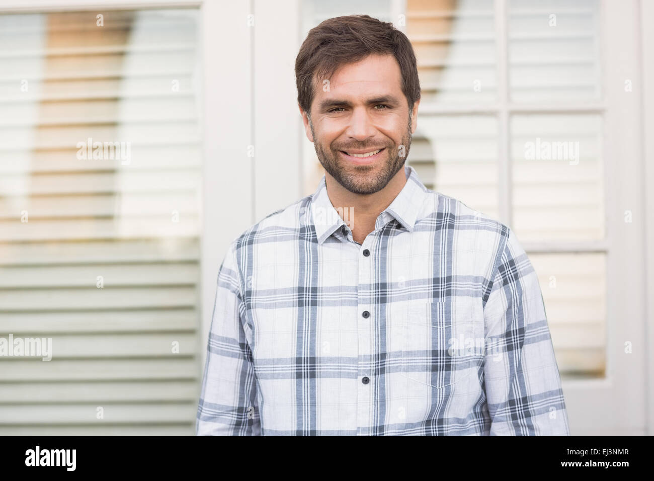 Happy man smiling at camera Stock Photo - Alamy
