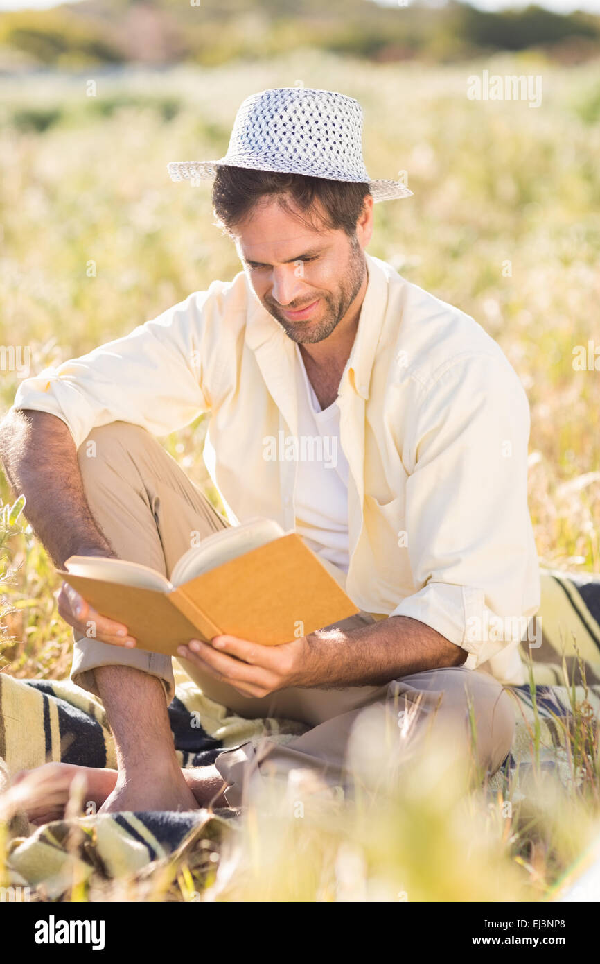 Happy man reading a book Stock Photo - Alamy