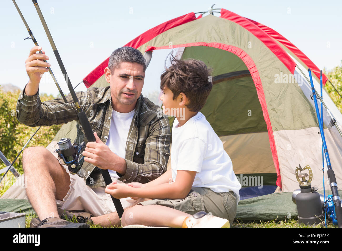 Father and son by their tent Stock Photo - Alamy