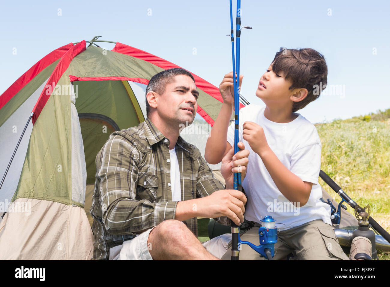 Father and son by their tent Stock Photo - Alamy