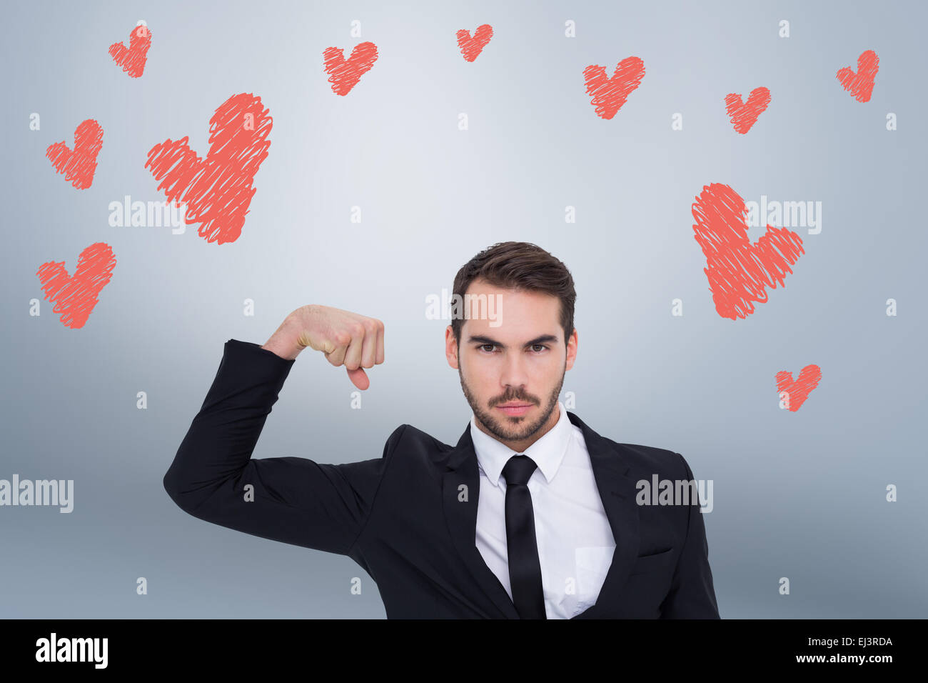 Man tensing bicep muscle hi-res stock photography and images - Alamy