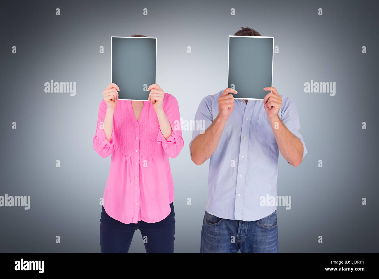 Composite image of people holding sheets over faces Stock Photo - Alamy