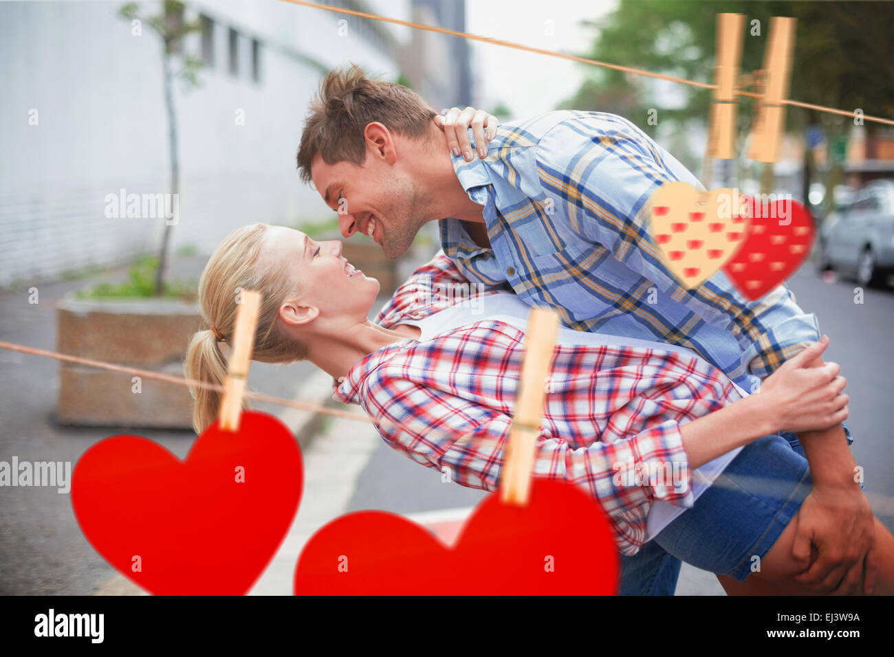 Composite image of hip romantic couple dancing in the street Stock ...
