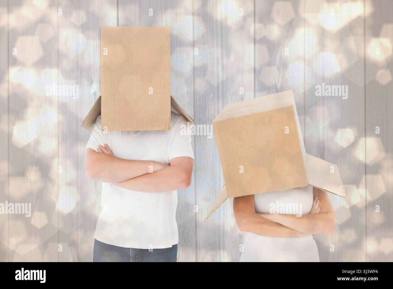 Composite image of mature couple wearing boxes over their heads Stock ...