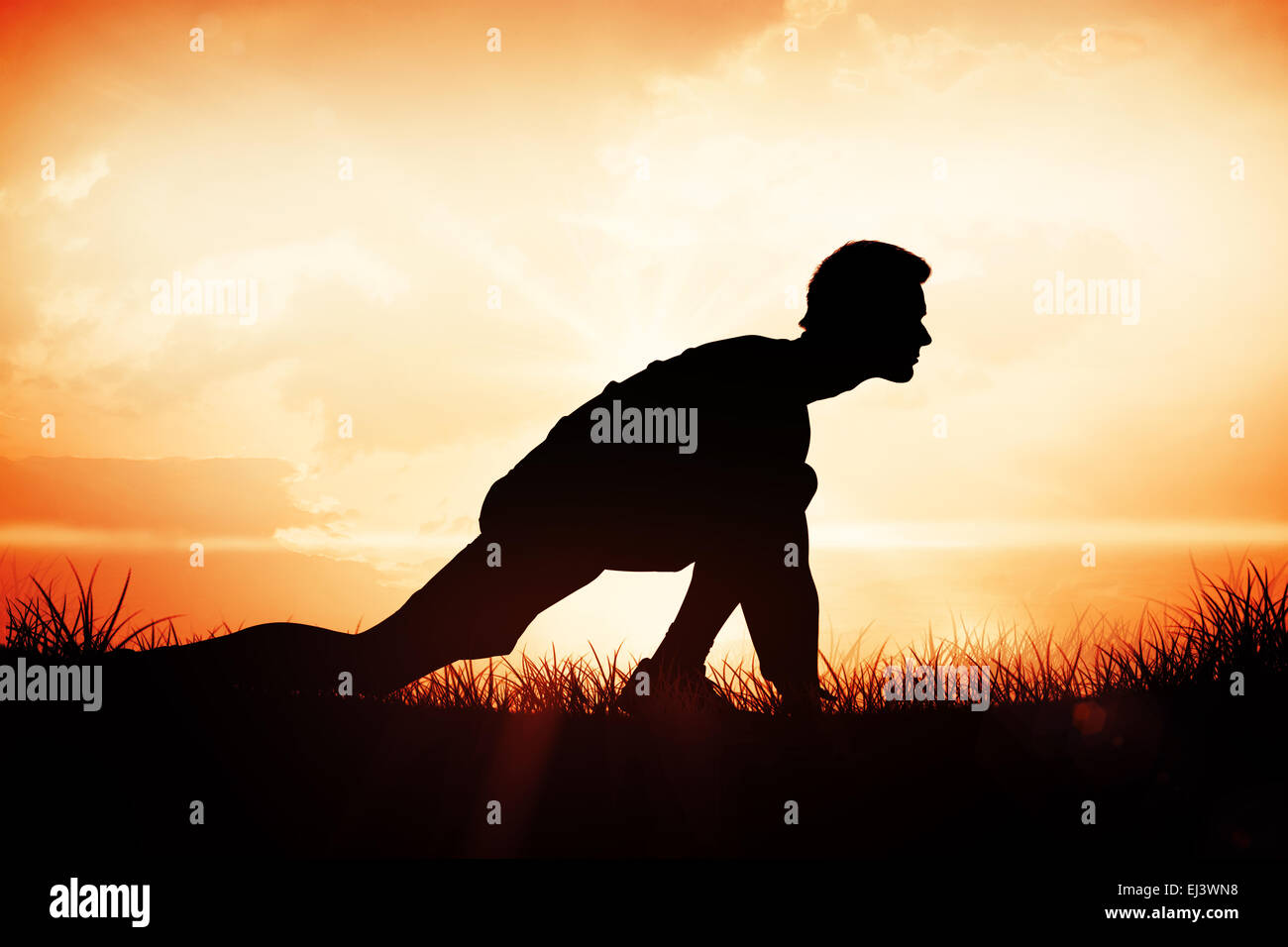 Composite image of side view of a young man in ready to run posture ...