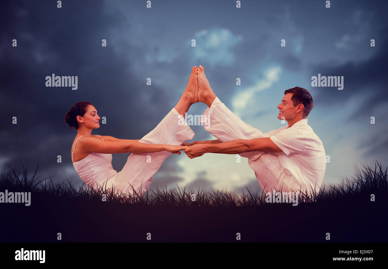 Composite image of peaceful couple sitting in boat position together ...