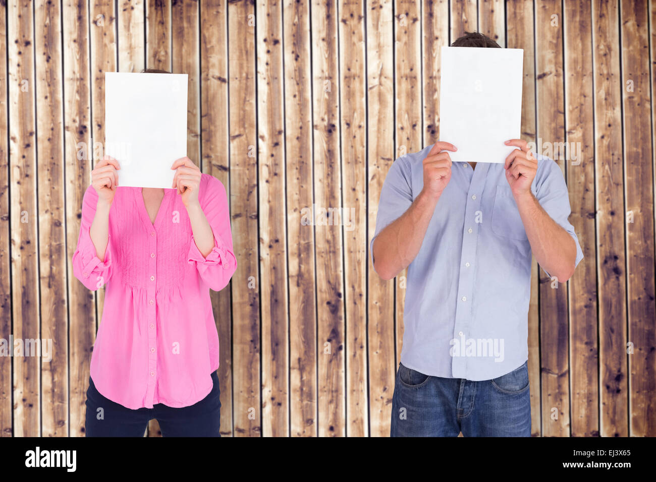 Composite image of people holding sheets over faces Stock Photo - Alamy