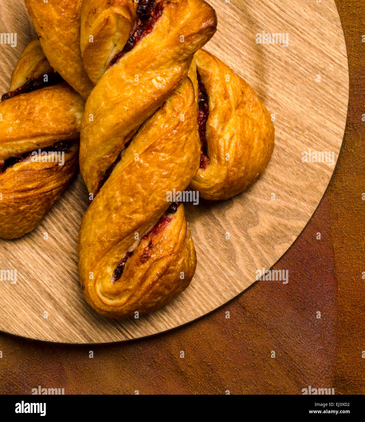 raspberry twist pastries close-up view Stock Photo - Alamy