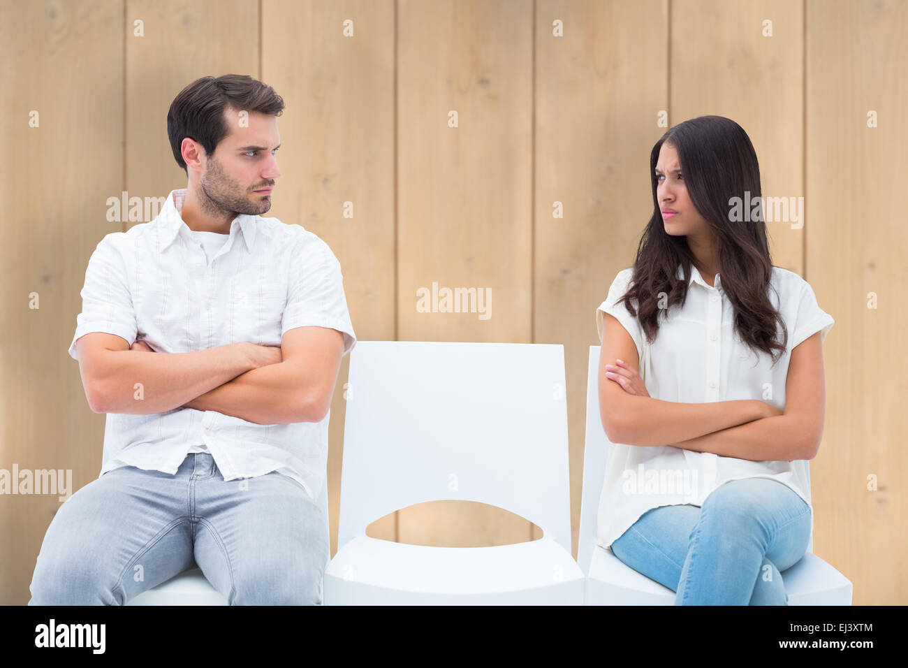 Composite image of angry couple not talking after argument Stock Photo ...