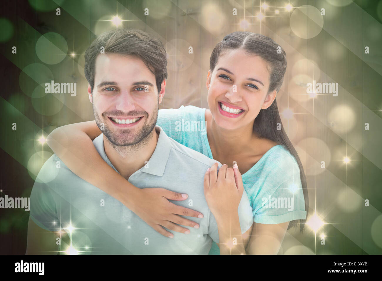 Composite image of cute couple smiling at camera Stock Photo - Alamy