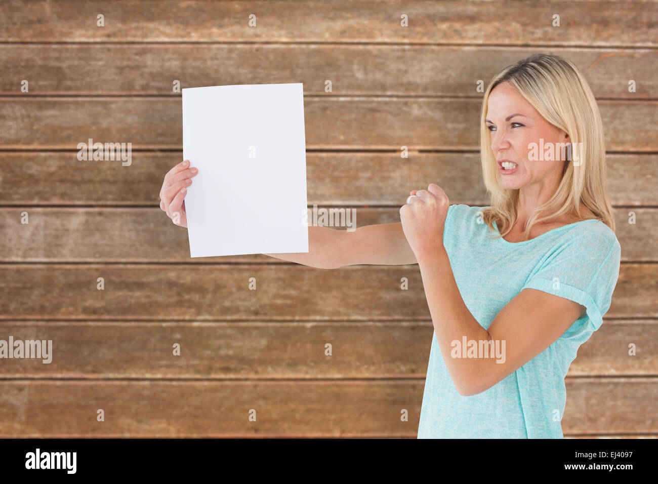 Woman holding piece of paper upset hi-res stock photography and images ...