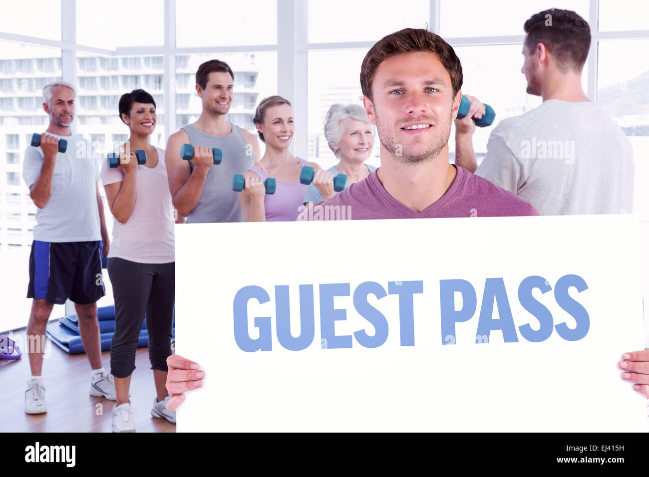 Composite image of man holding up a sign Stock Photo - Alamy