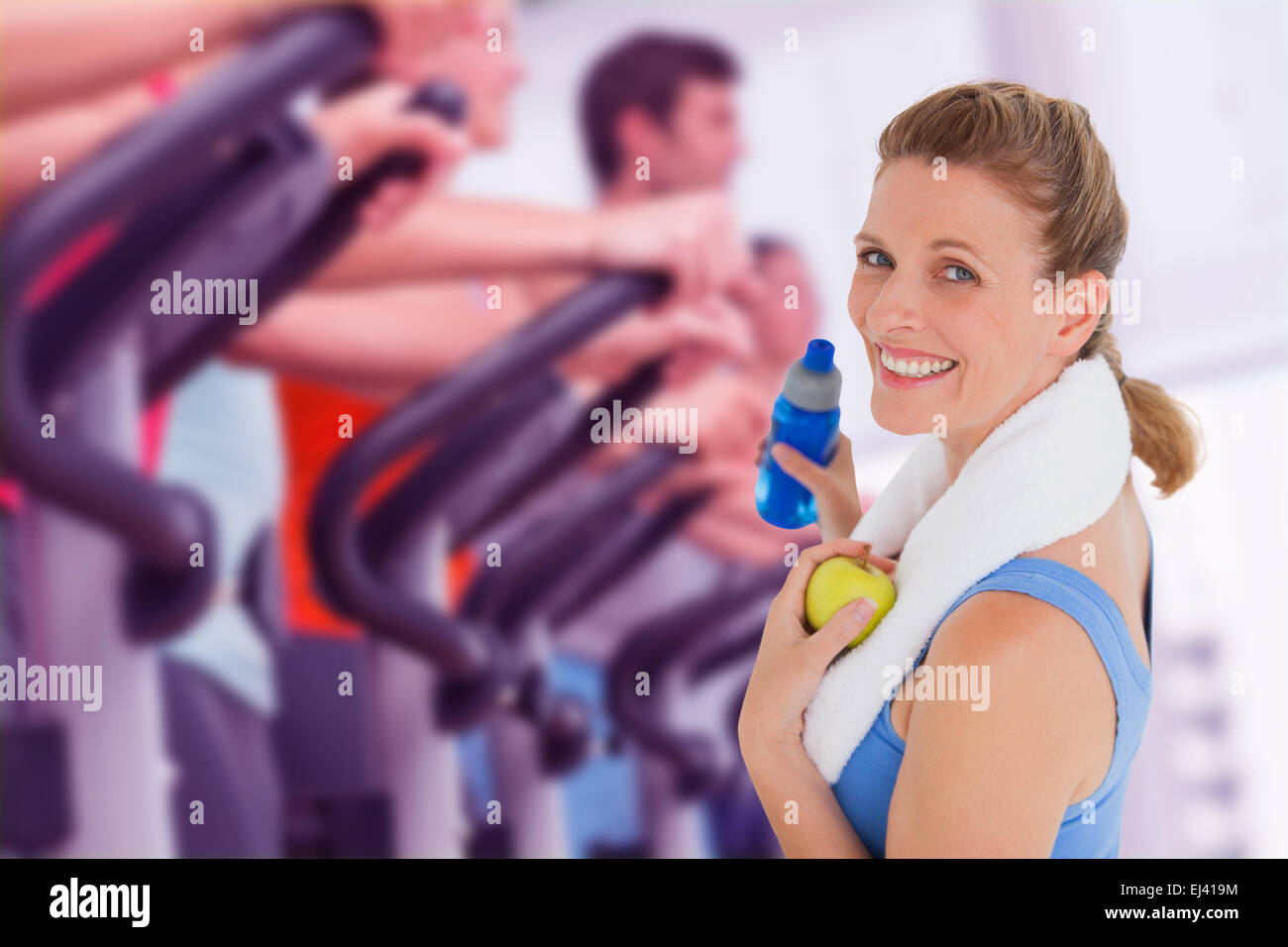 Fit woman smiling at camera Stock Photo - Alamy