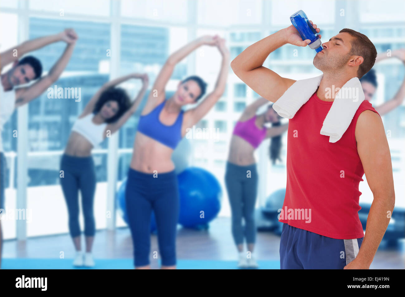 Fit man drinking water from bottle Stock Photo - Alamy