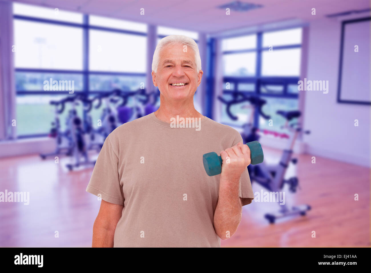 Composite image of senior man lifting hand weights Stock Photo - Alamy