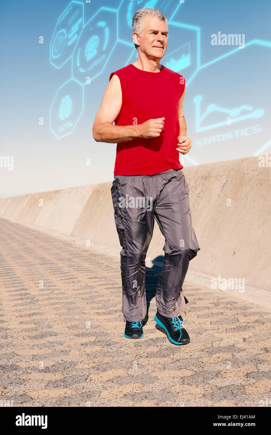 Composite image of active senior man jogging on the pier Stock Photo ...