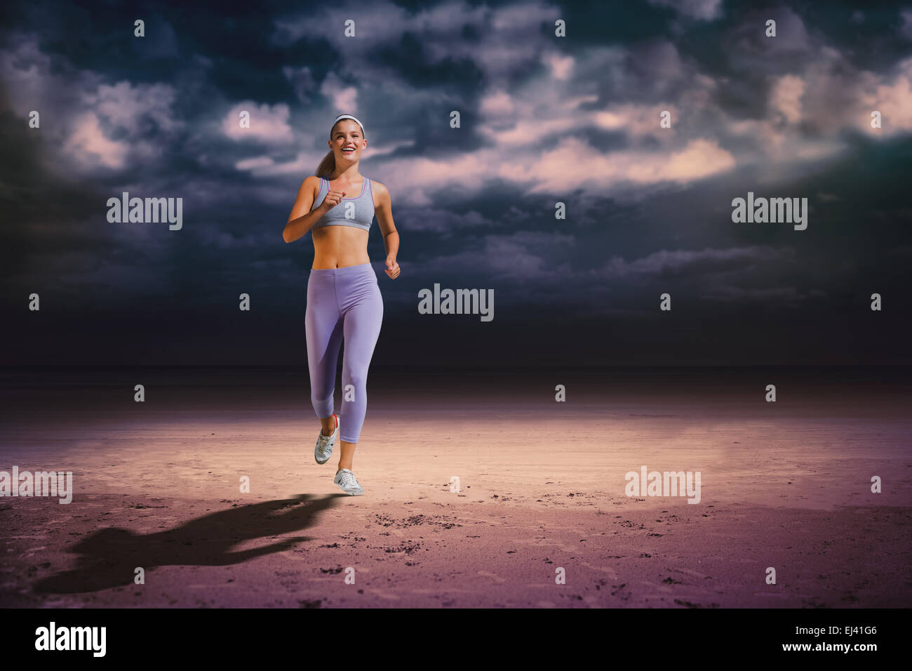 Fit blonde jogging towards camera hi-res stock photography and images ...