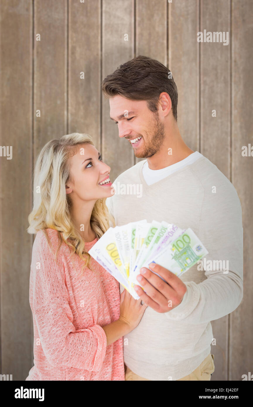 Young man holding cash notes hi-res stock photography and images - Alamy