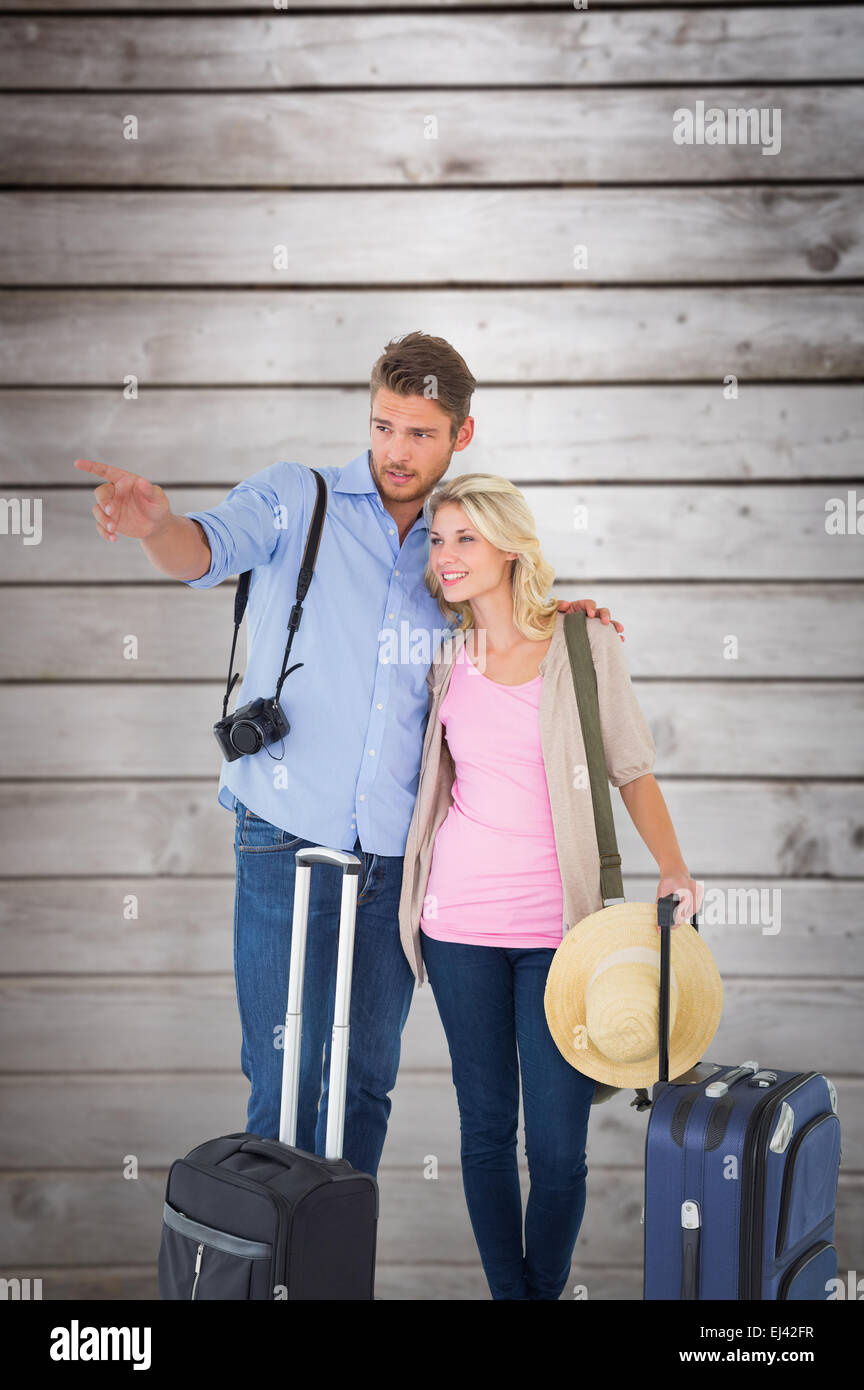Composite image of attractive young couple ready to go on vacation ...