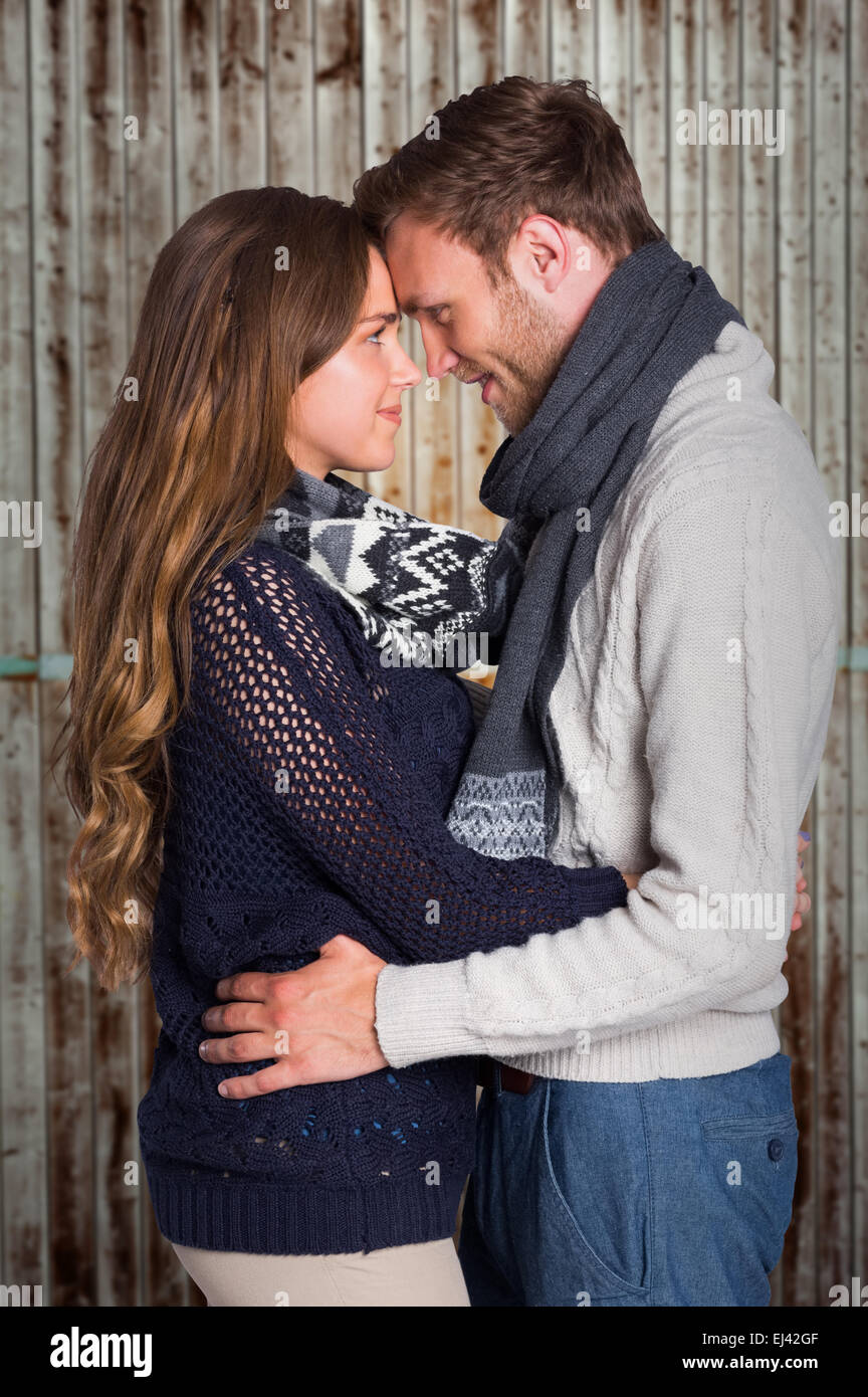 Composite image of side view of young couple embracing Stock Photo - Alamy
