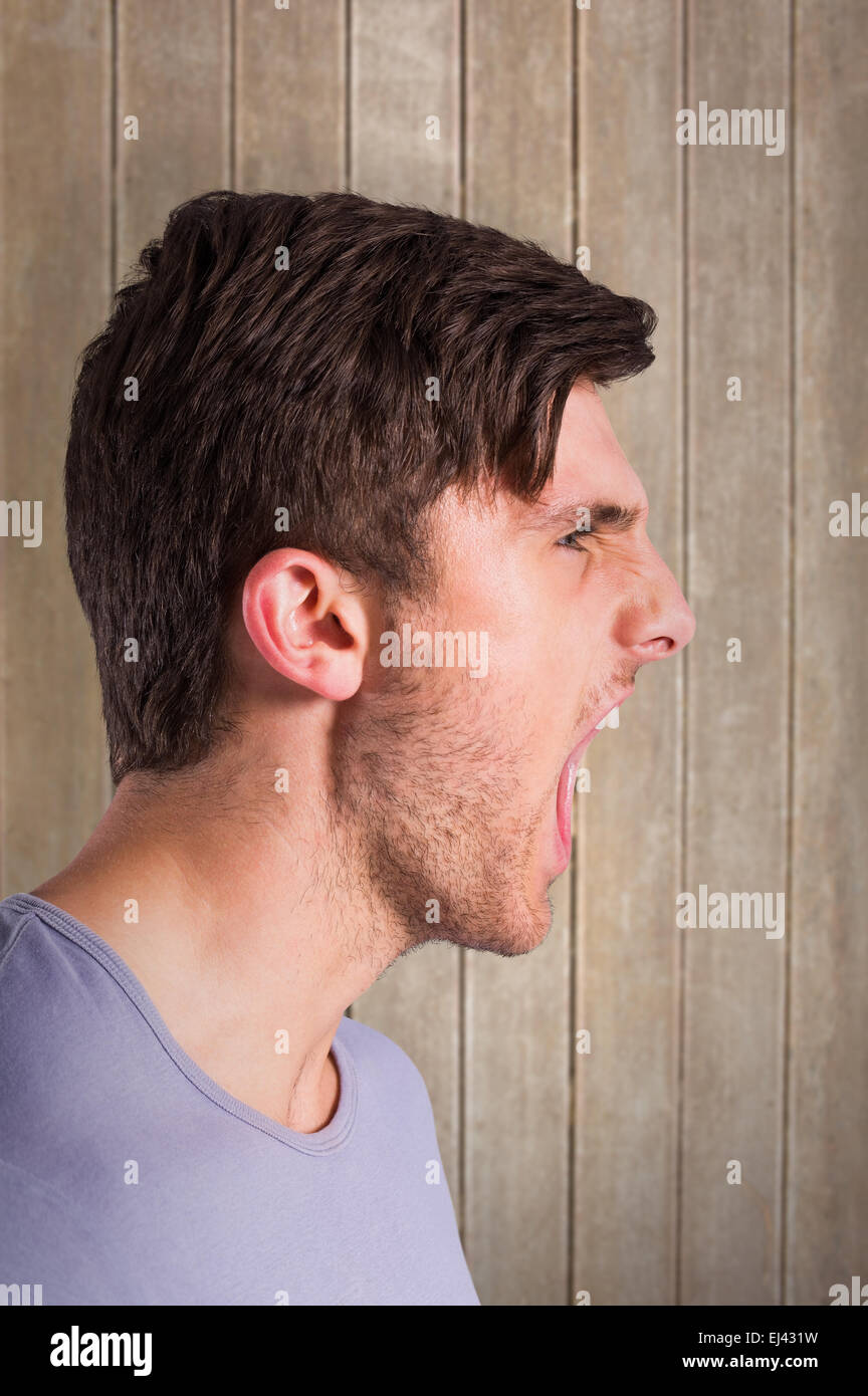 Composite image of angry young man with stubble shouting Stock Photo ...