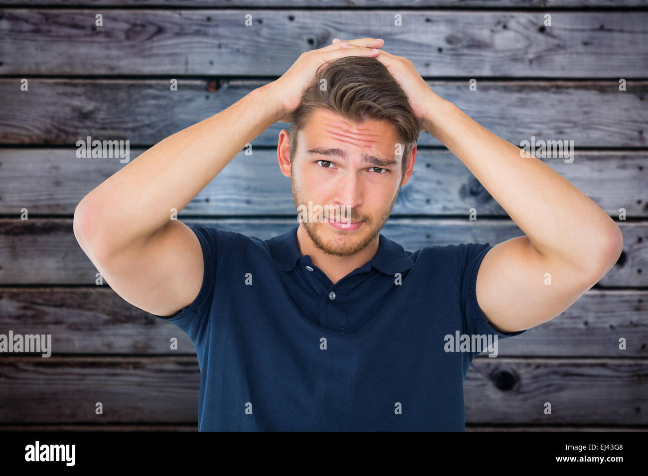Composite image of handsome young man looking confused Stock Photo - Alamy