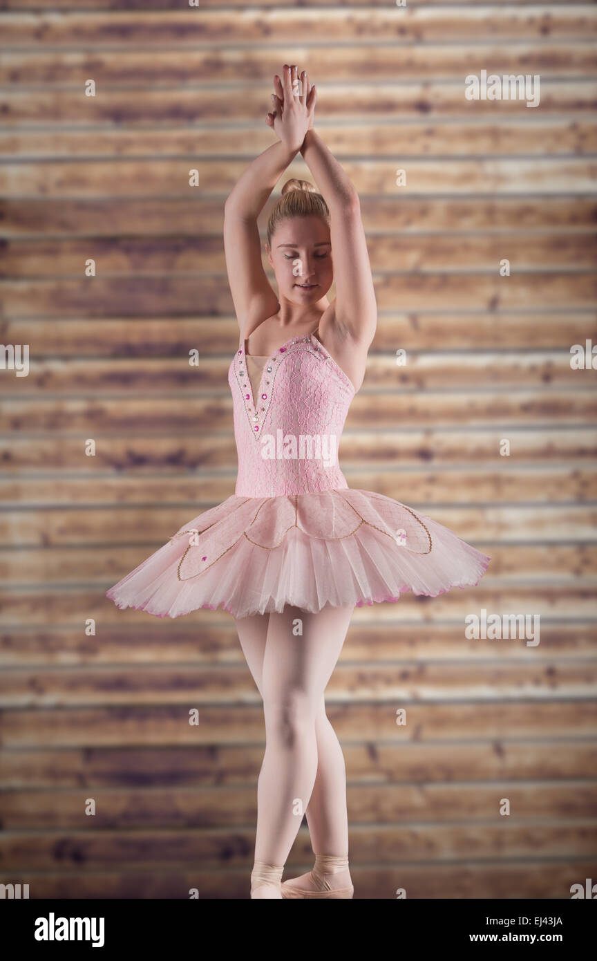 Composite image of pretty ballerina in pink Stock Photo - Alamy