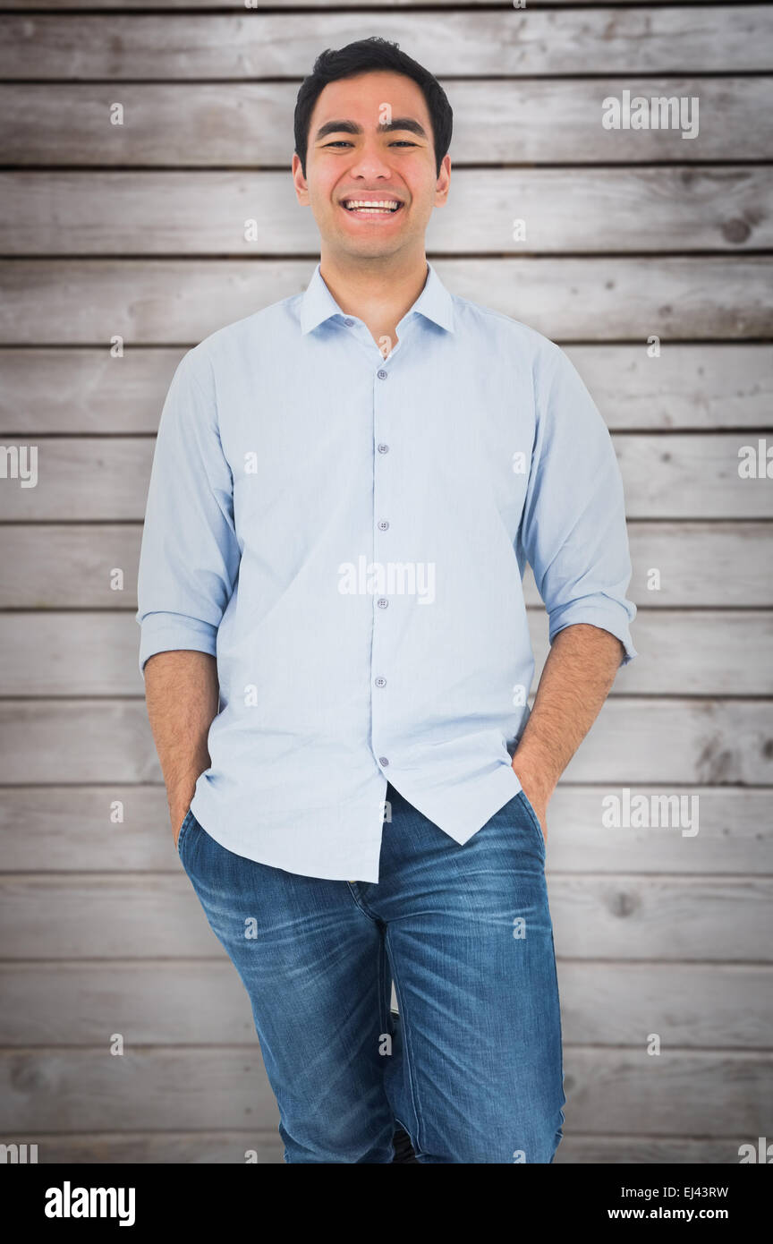Composite image of smiling casual man standing Stock Photo - Alamy