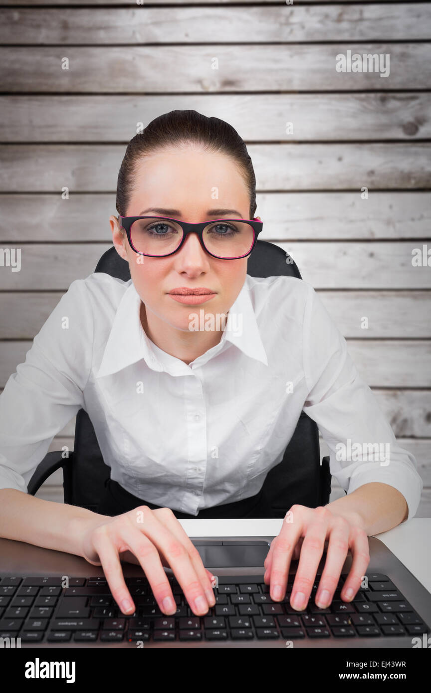 Composite image of businesswoman typing on a keyboard Stock Photo - Alamy