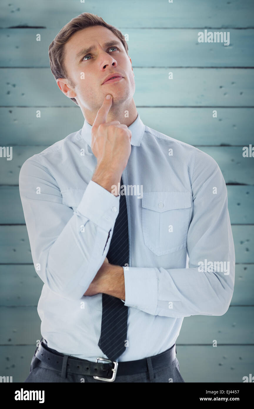Composite image of thinking businessman with finger on chin Stock Photo ...