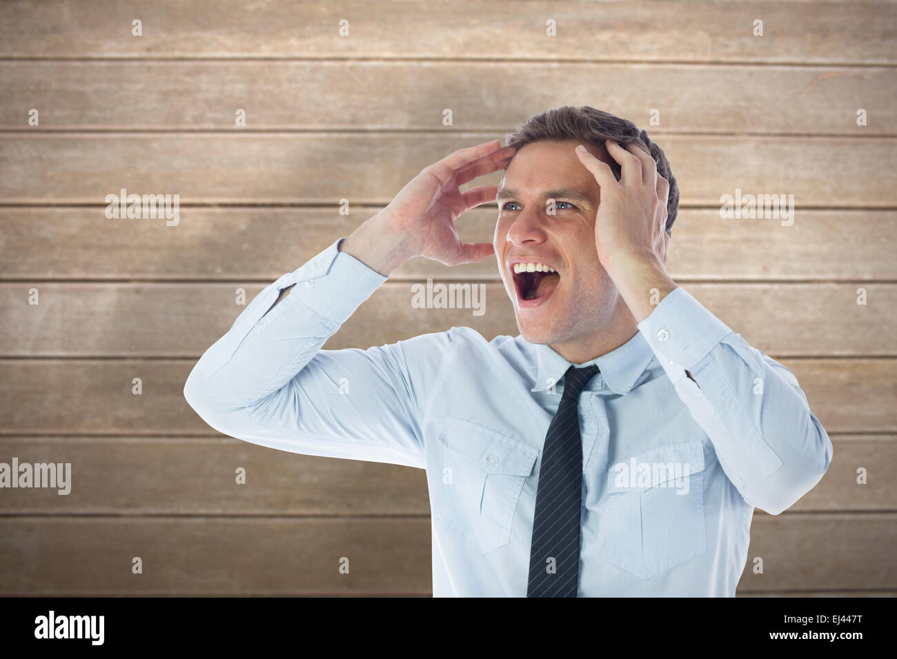 Composite image of stressed businessman shouting Stock Photo - Alamy