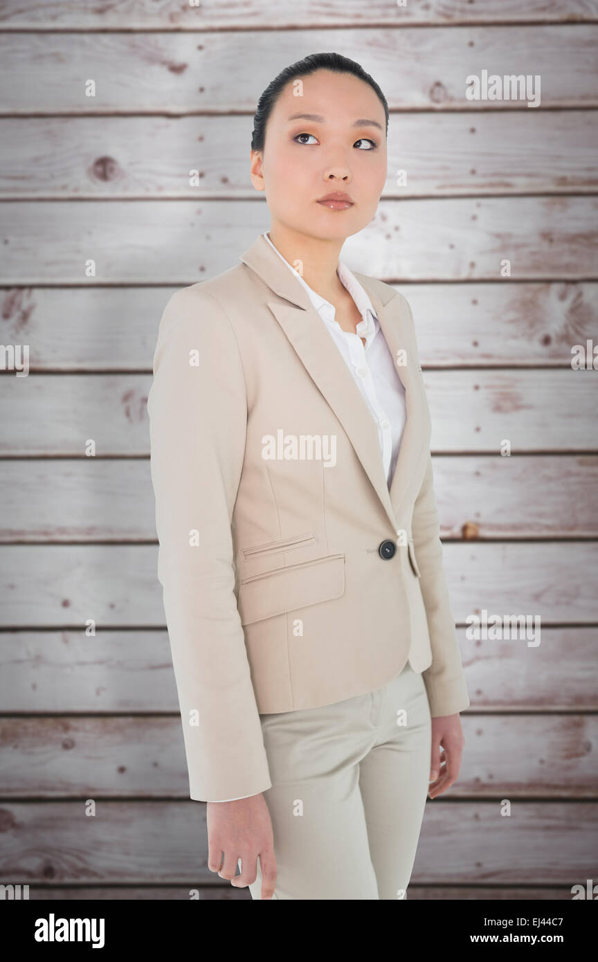 Composite image of unsmiling asian businesswoman walking Stock Photo ...
