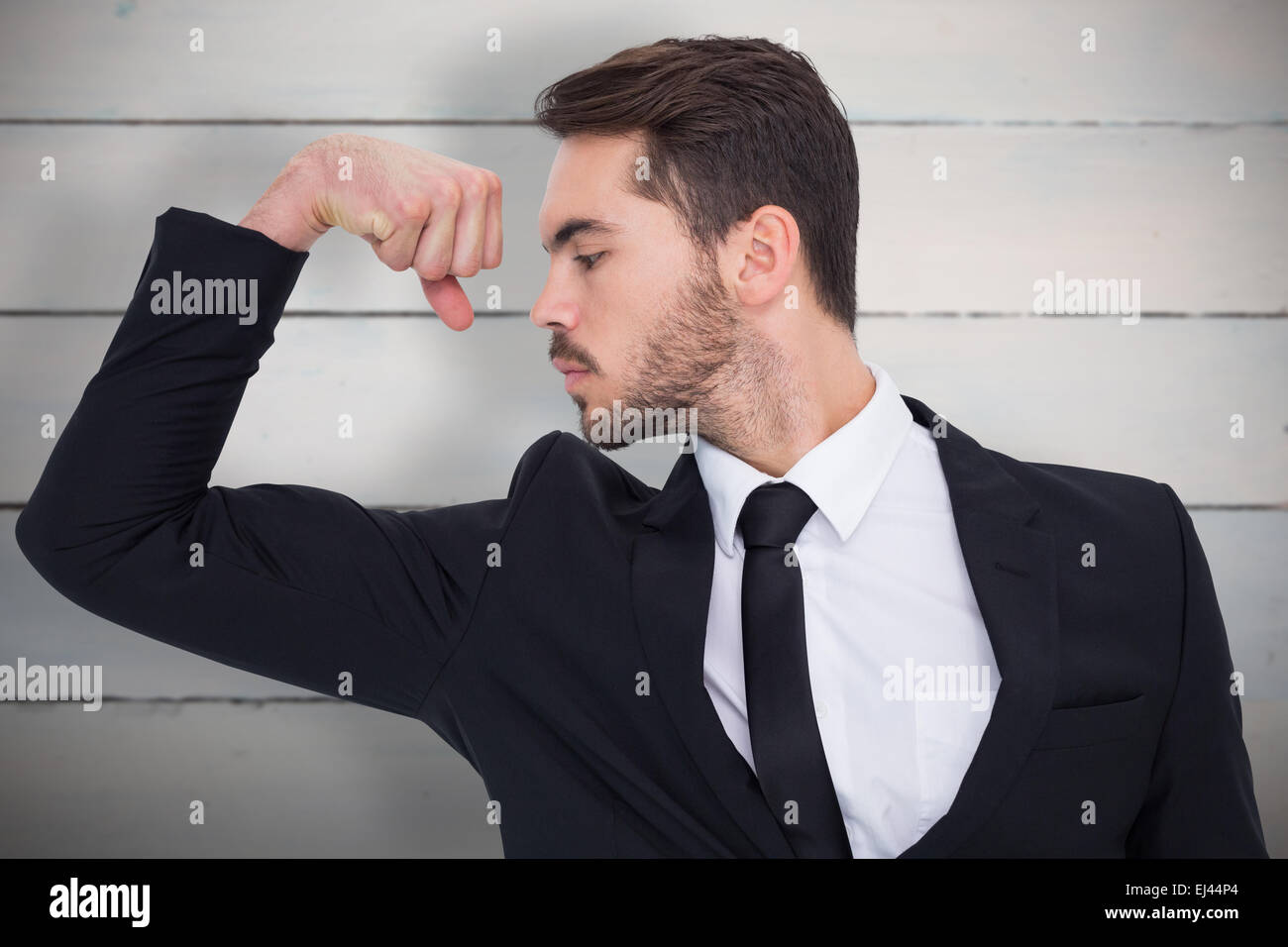 Man tensing bicep muscle hi-res stock photography and images - Alamy