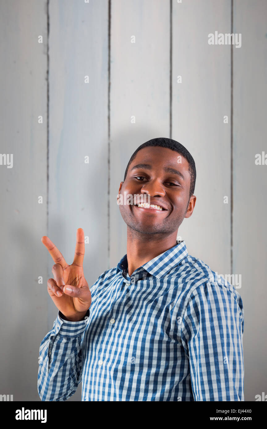 Man making peace sign hi-res stock photography and images - Alamy
