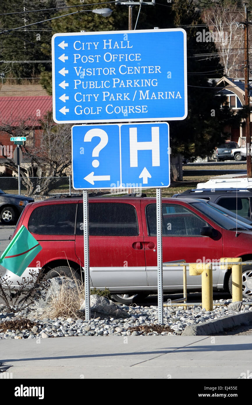 A sign in a small town directs visitors to local services and ...