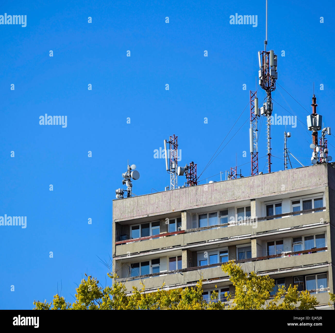 Antennas on the top of a high building Stock Photo - Alamy