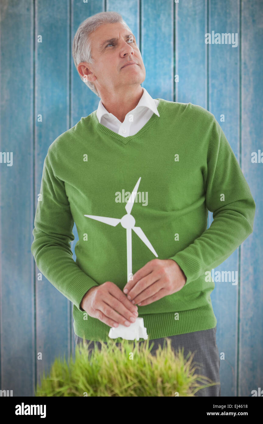 Composite image of man thinking about wind turbines Stock Photo - Alamy