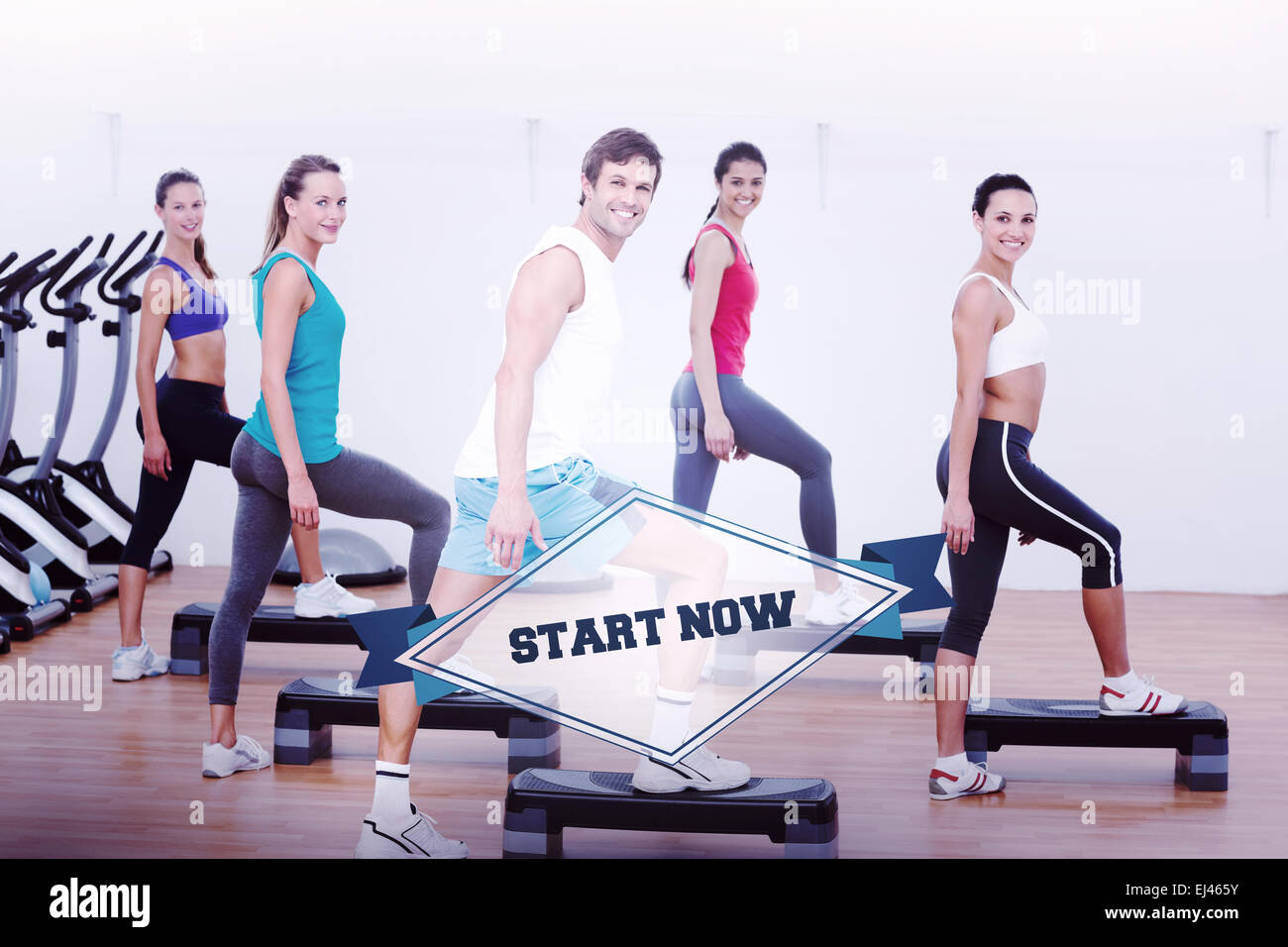 The word start now and fitness class performing step aerobics Stock ...