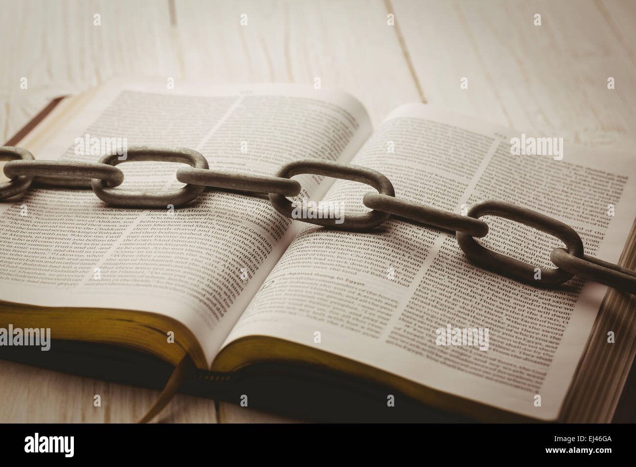 Open bible and heavy chain Stock Photo - Alamy