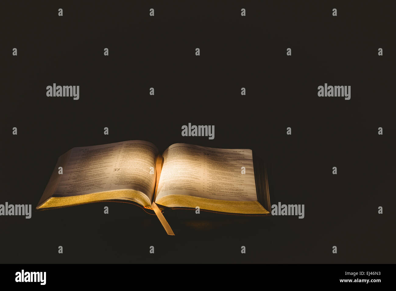 Light shining on open bible Stock Photo - Alamy