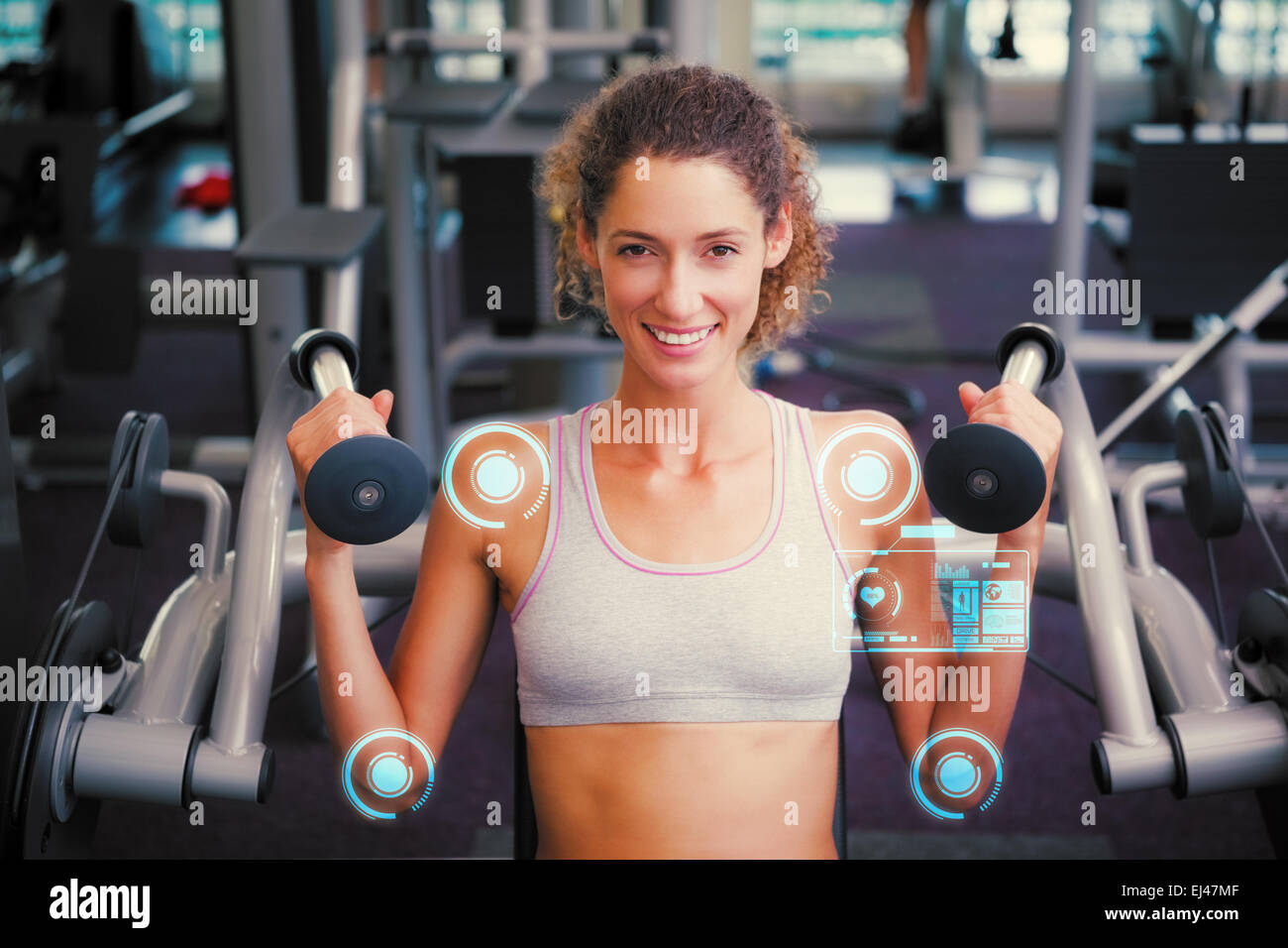 Composite image of fit smiling woman using the weights machine for her ...