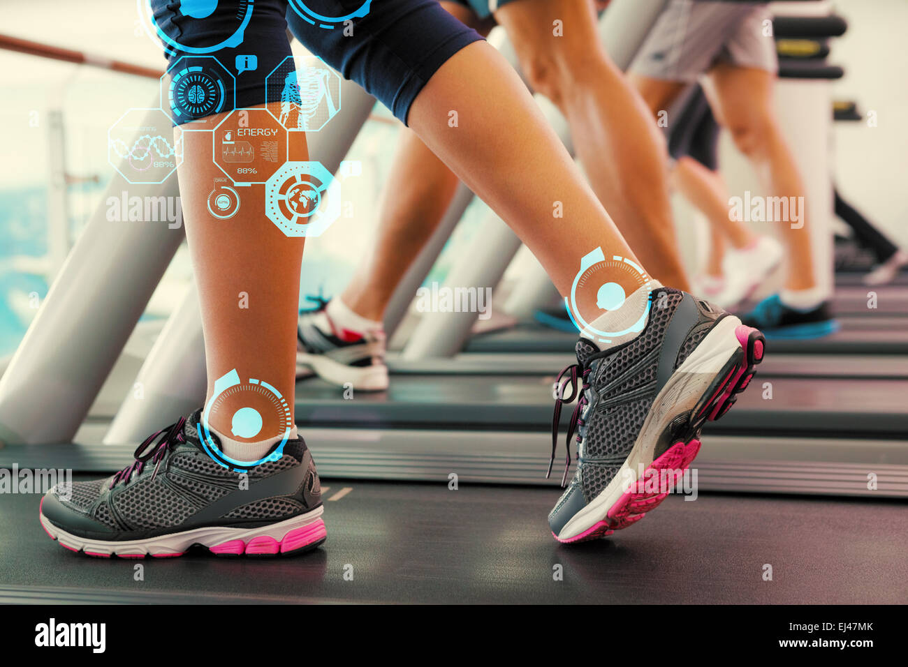 Composite image of row of people working out on treadmills Stock Photo ...