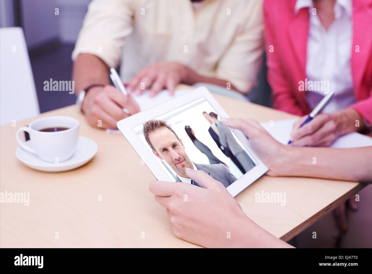 Team meeting using tablet and phone hi-res stock photography and images ...