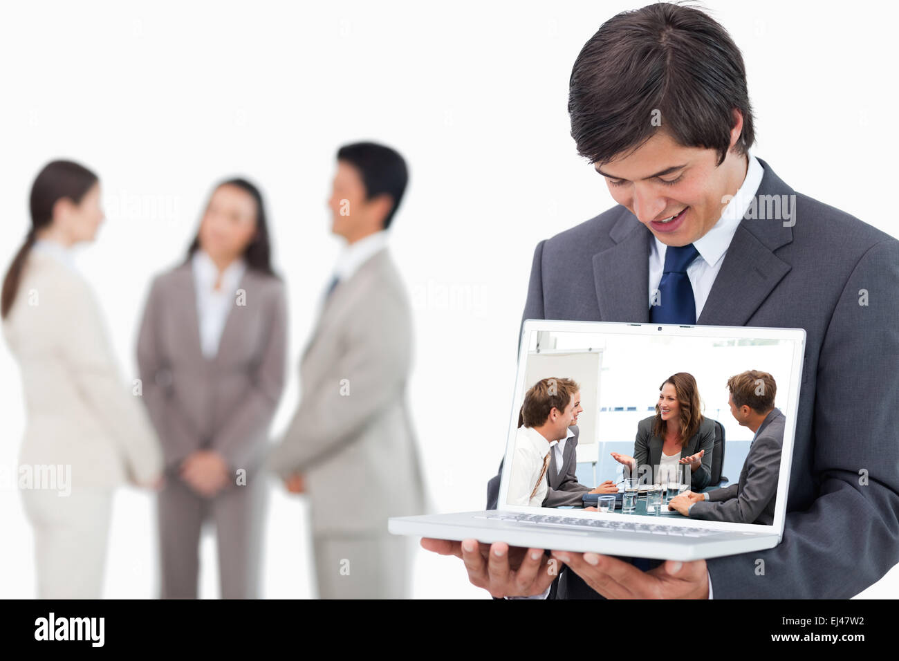 Salesman showing a laptop Stock Photo - Alamy