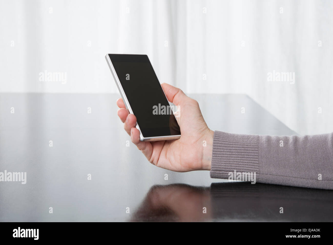 woman hand grey sweater finger touching digital phone mobile blank ...