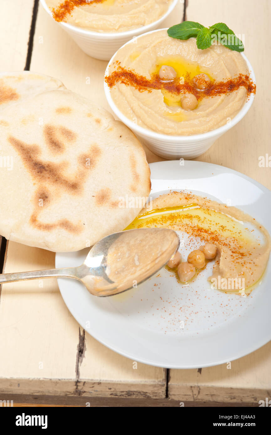traditional chickpeas Hummus with pita bread and paprika on top Stock ...