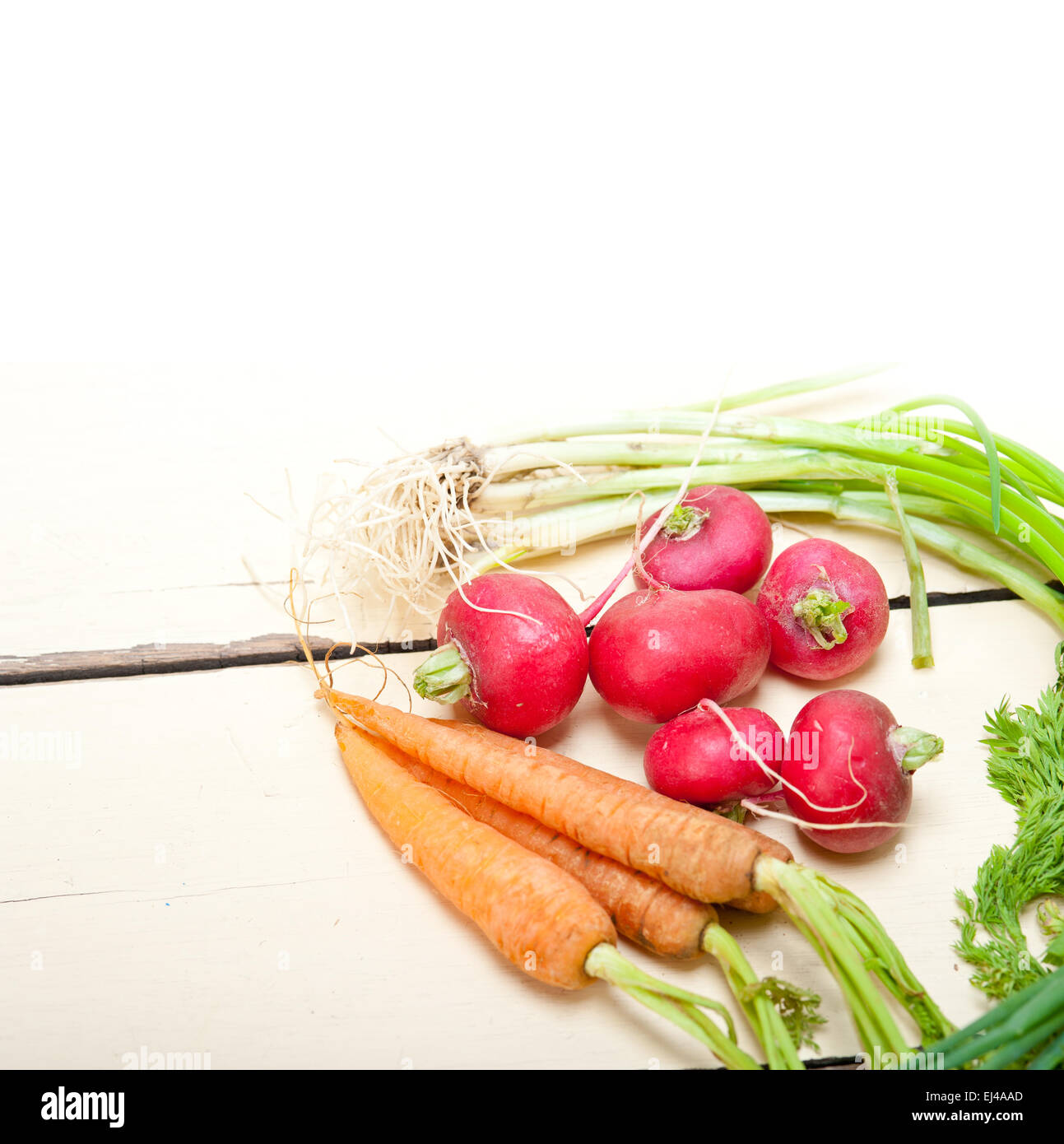 raw root vegetable on a rustic white wood table Stock Photo - Alamy
