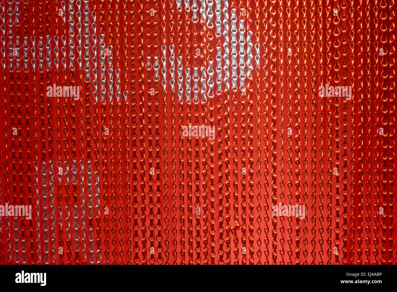 Red metallic aluminium string courtain as a background Stock Photo - Alamy