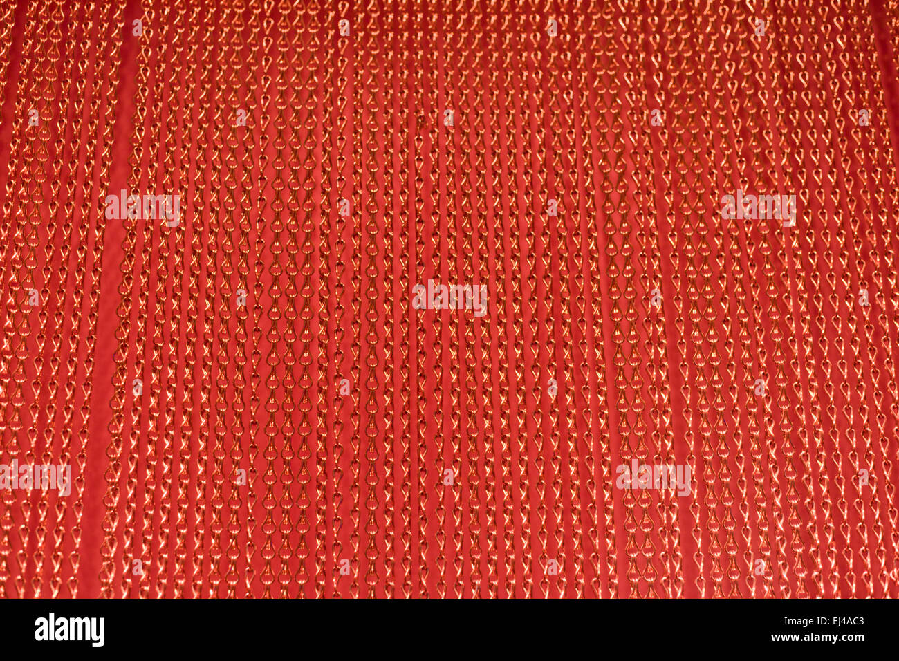 Red metallic aluminium string courtain as a background Stock Photo - Alamy