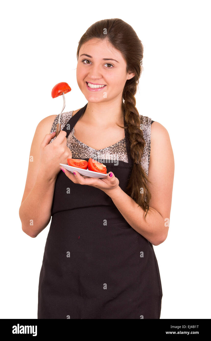 beautiful young girl eating fresh tomatoes Stock Photo - Alamy